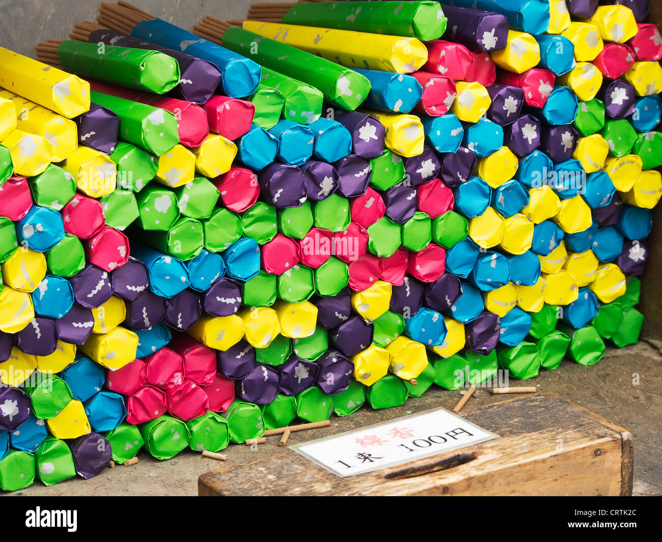 Incense Sticks with 100 Yen Sign Stock Photo - Alamy