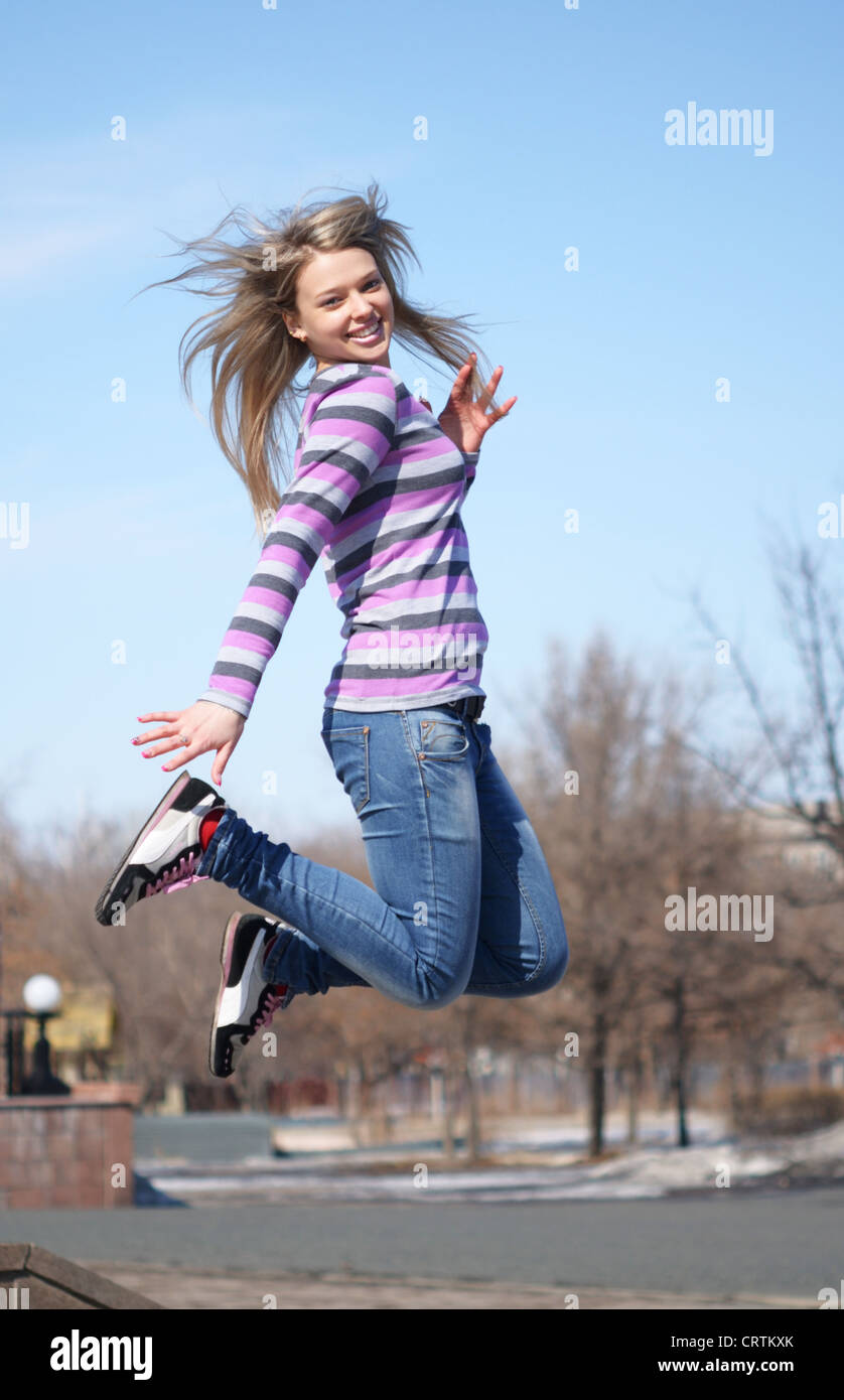 an image of jumping happy girl Stock Photo - Alamy