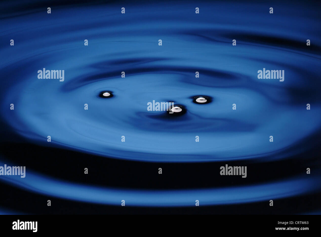 Water drops beats on water surface Stock Photo - Alamy