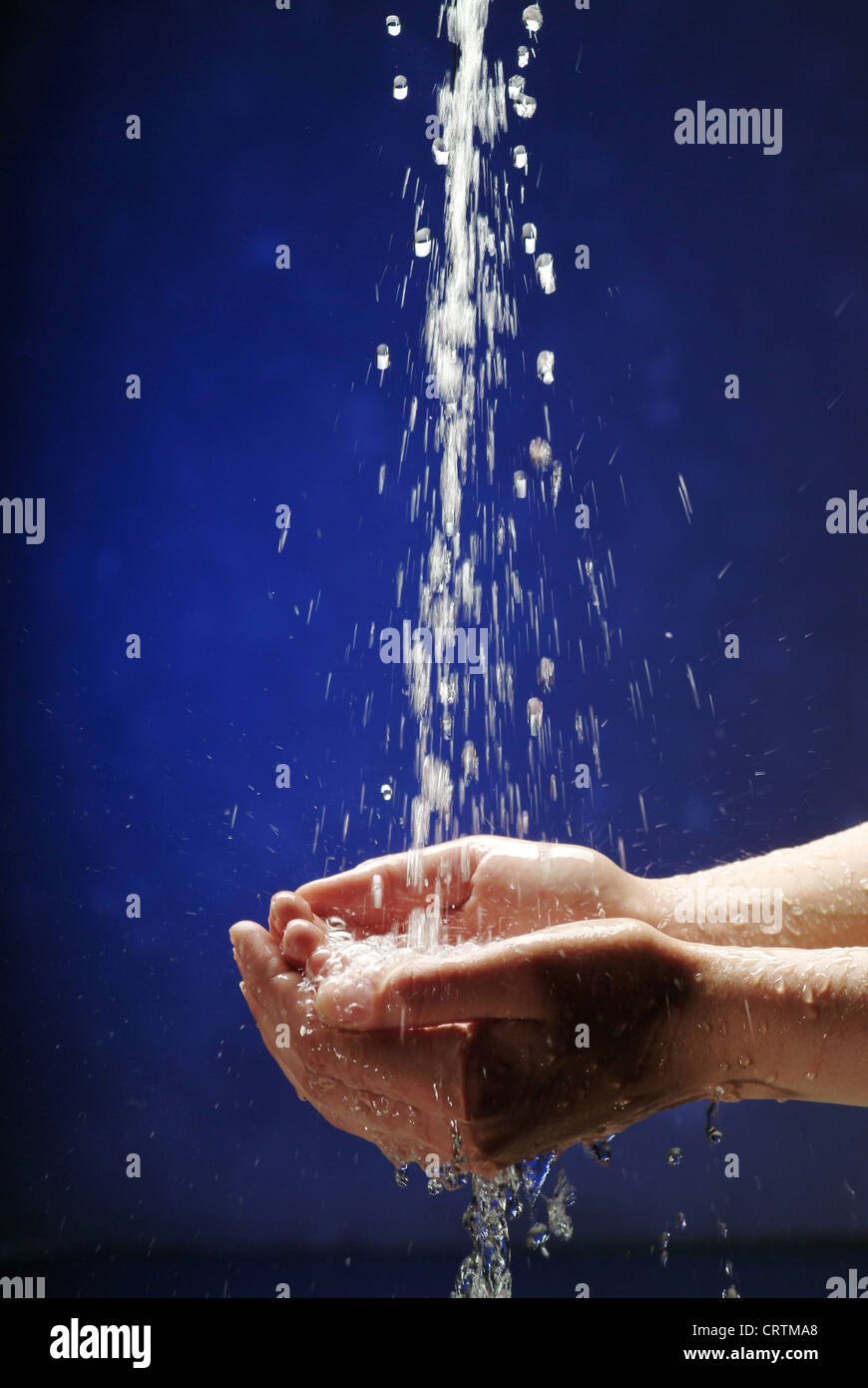 Hands under a stream of water Stock Photo - Alamy
