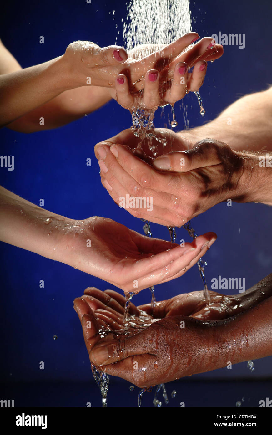 Many different hands under a stream of water Stock Photo - Alamy