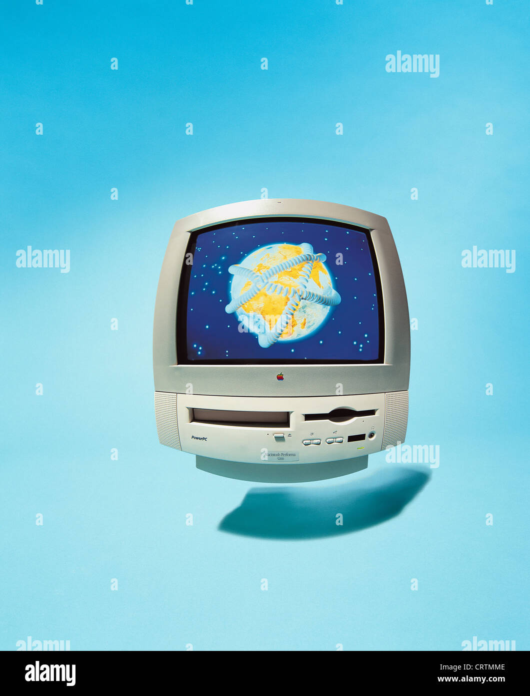 Computer with globe on monitor Stock Photo - Alamy