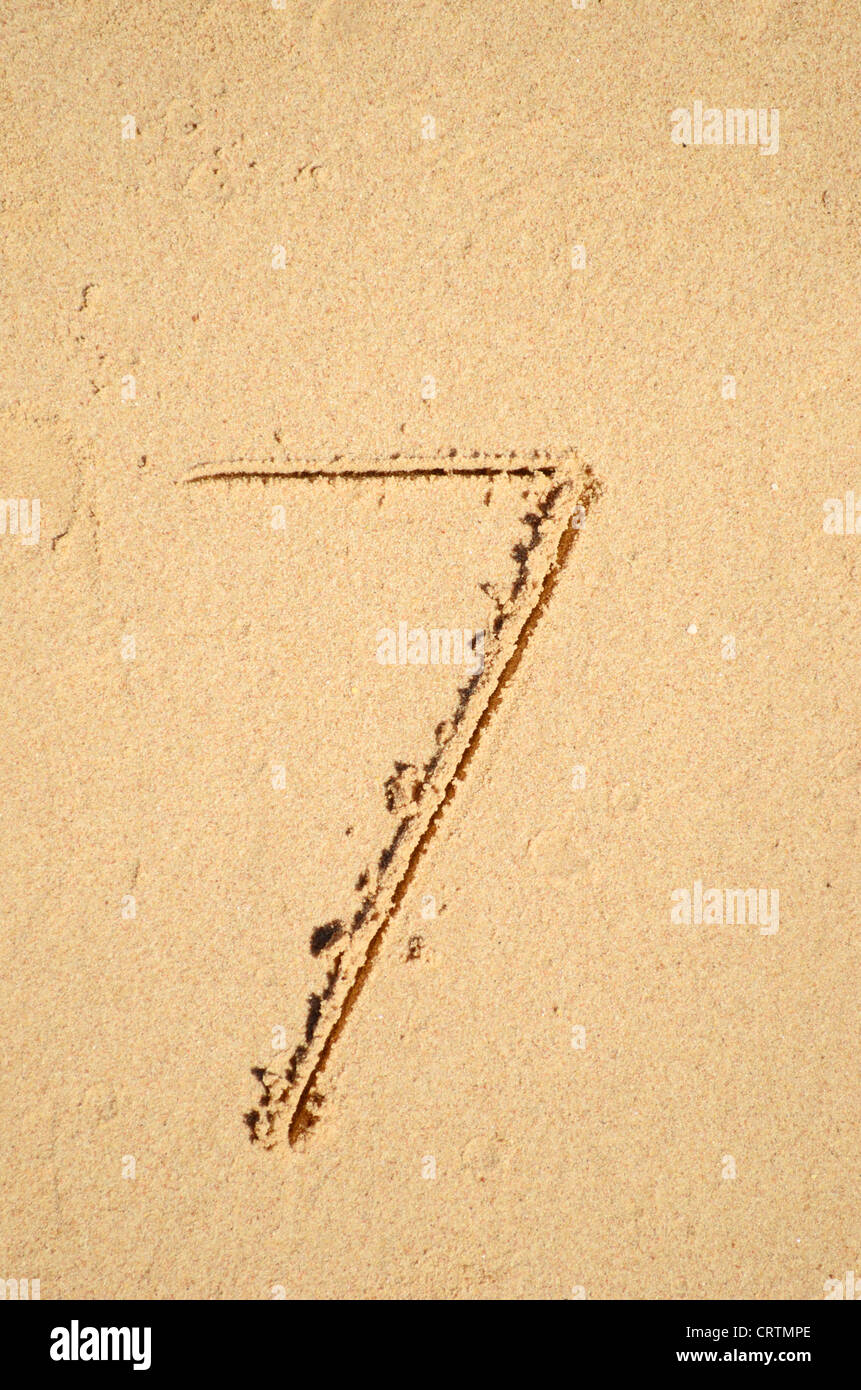 number seven written on the sand Stock Photo - Alamy