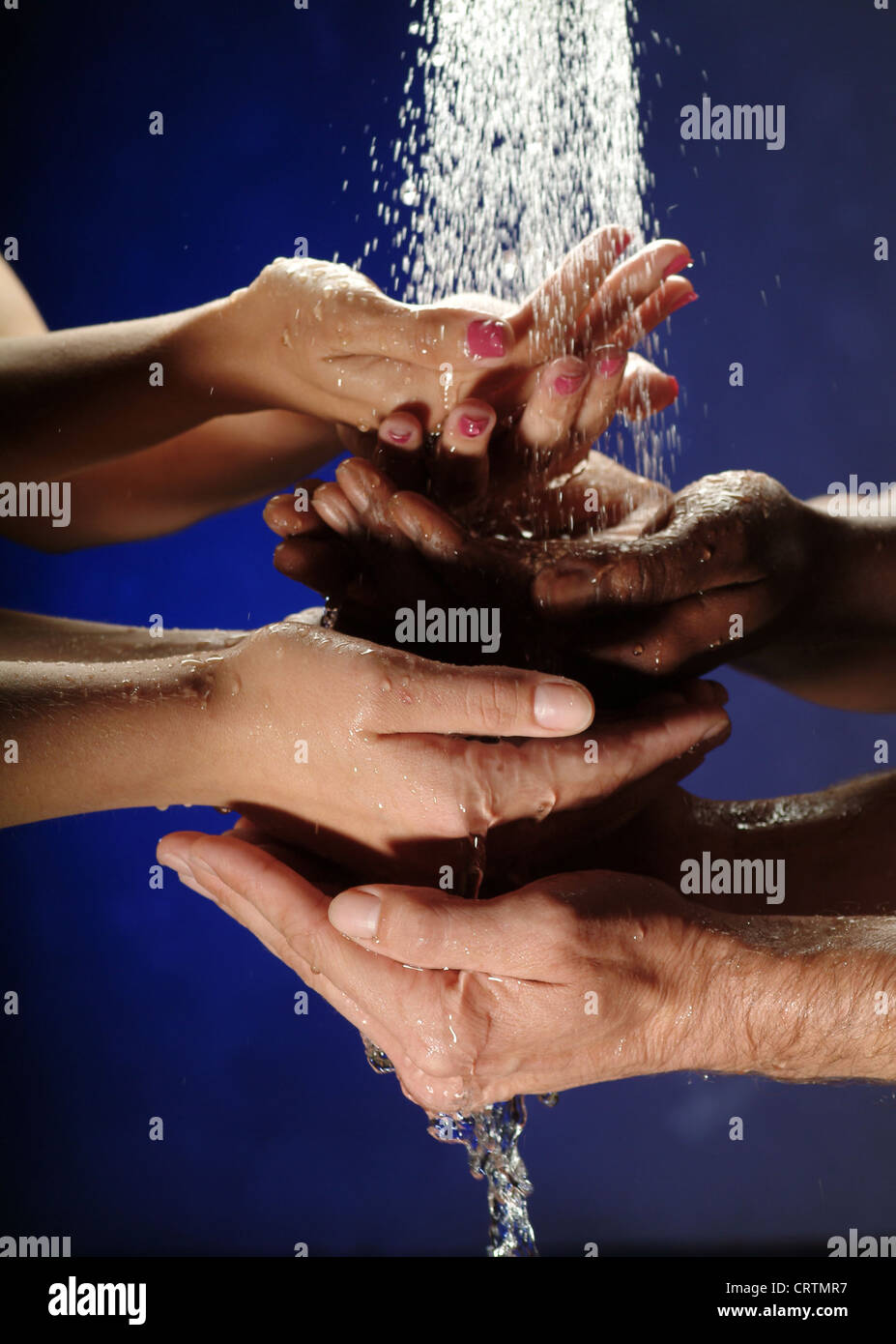 Many different hands under a stream of water Stock Photo - Alamy