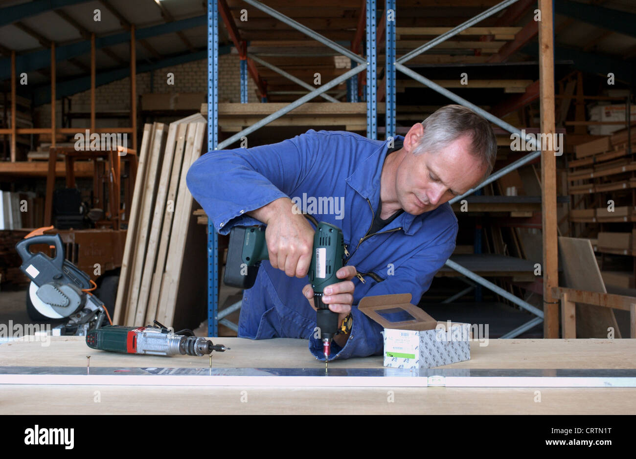 A carpenter in the assembly of market stalls Stock Photo - Alamy