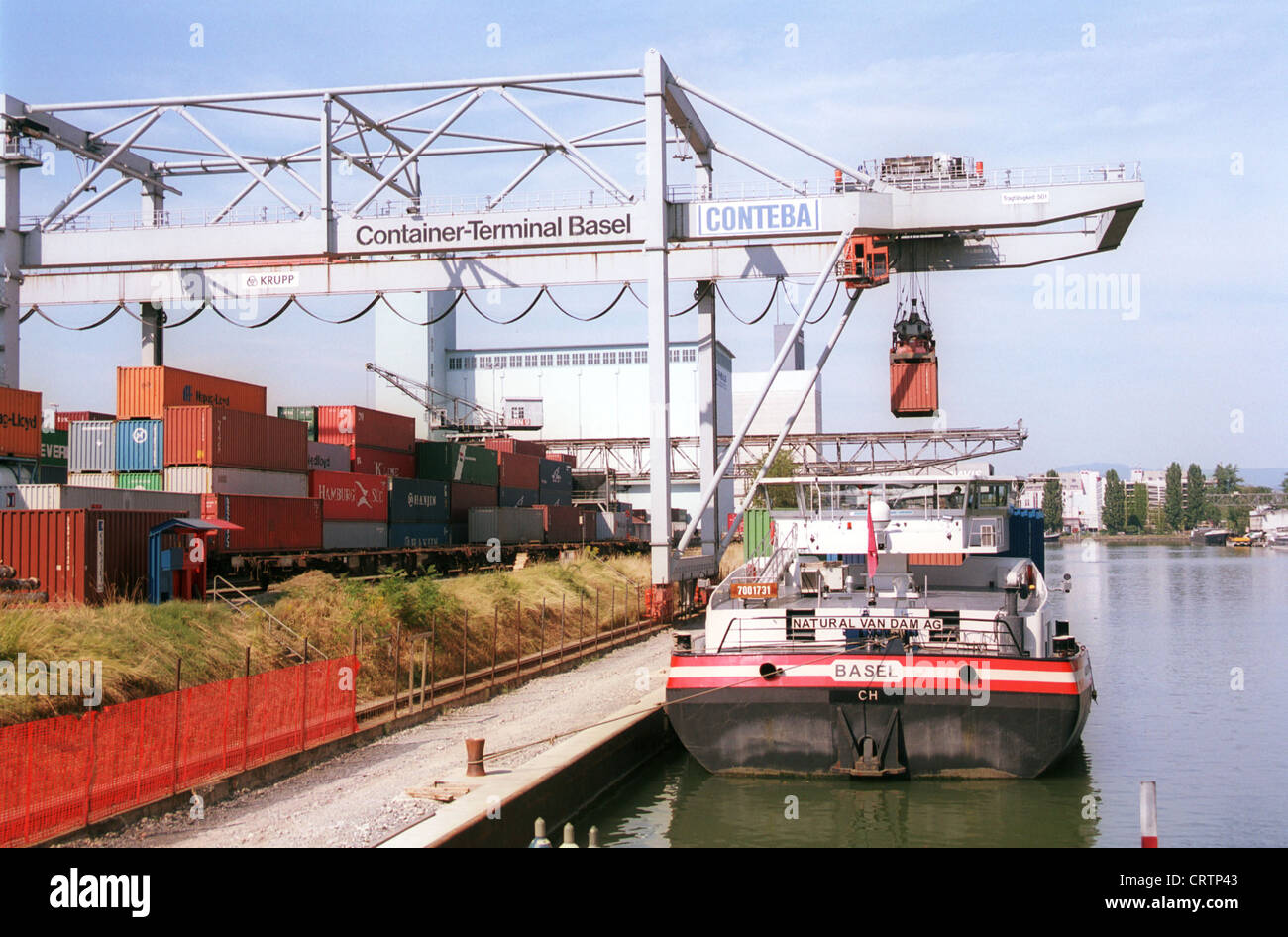 Rhine port of Basel: ship is loaded with containers Stock Photo - Alamy