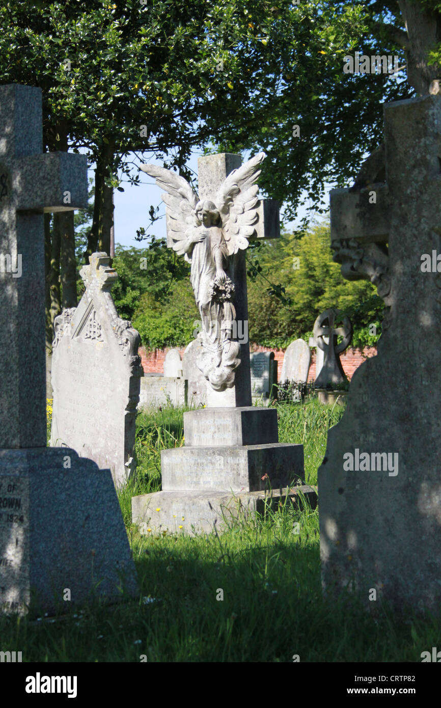 Graveyard and bell tower of church Stock Photo - Alamy