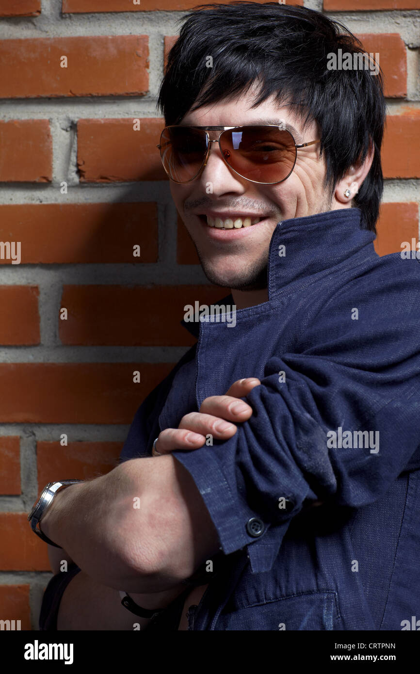 man near brick wall Stock Photo - Alamy
