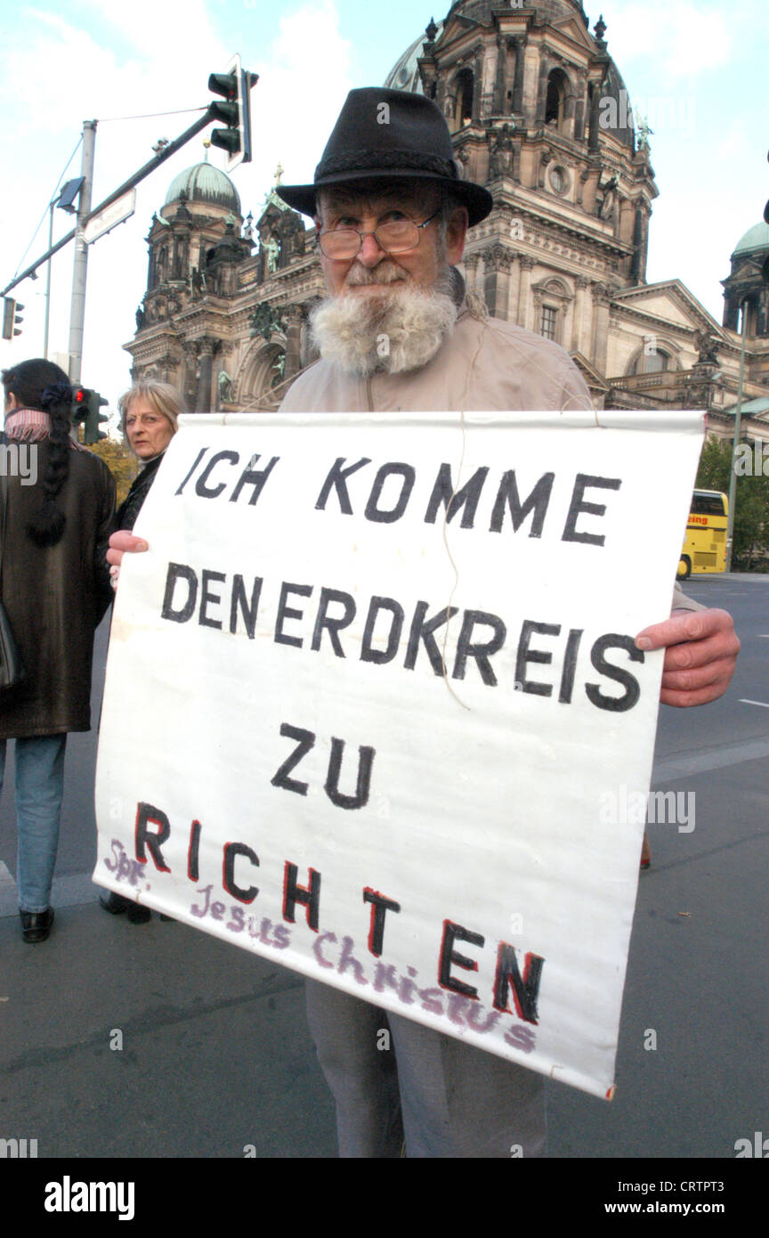 Man with poster, Berlin Stock Photo - Alamy