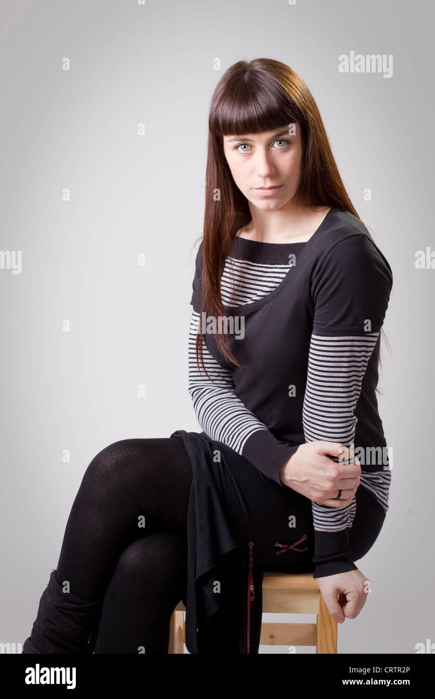 portrait of a young woman posing during a photo session Stock Photo - Alamy
