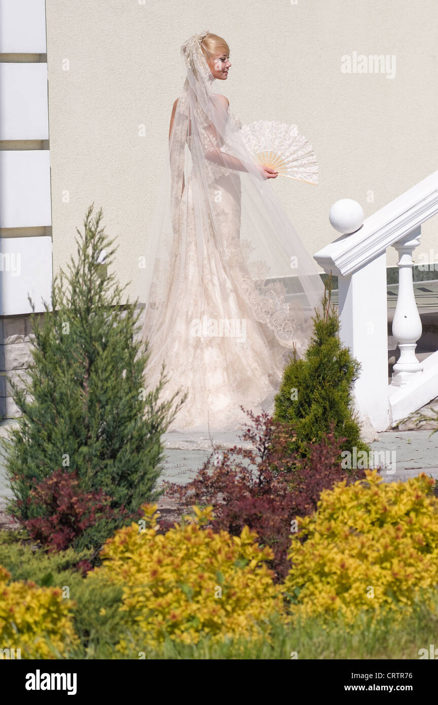 Bride In The Garden Stock Photo - Alamy