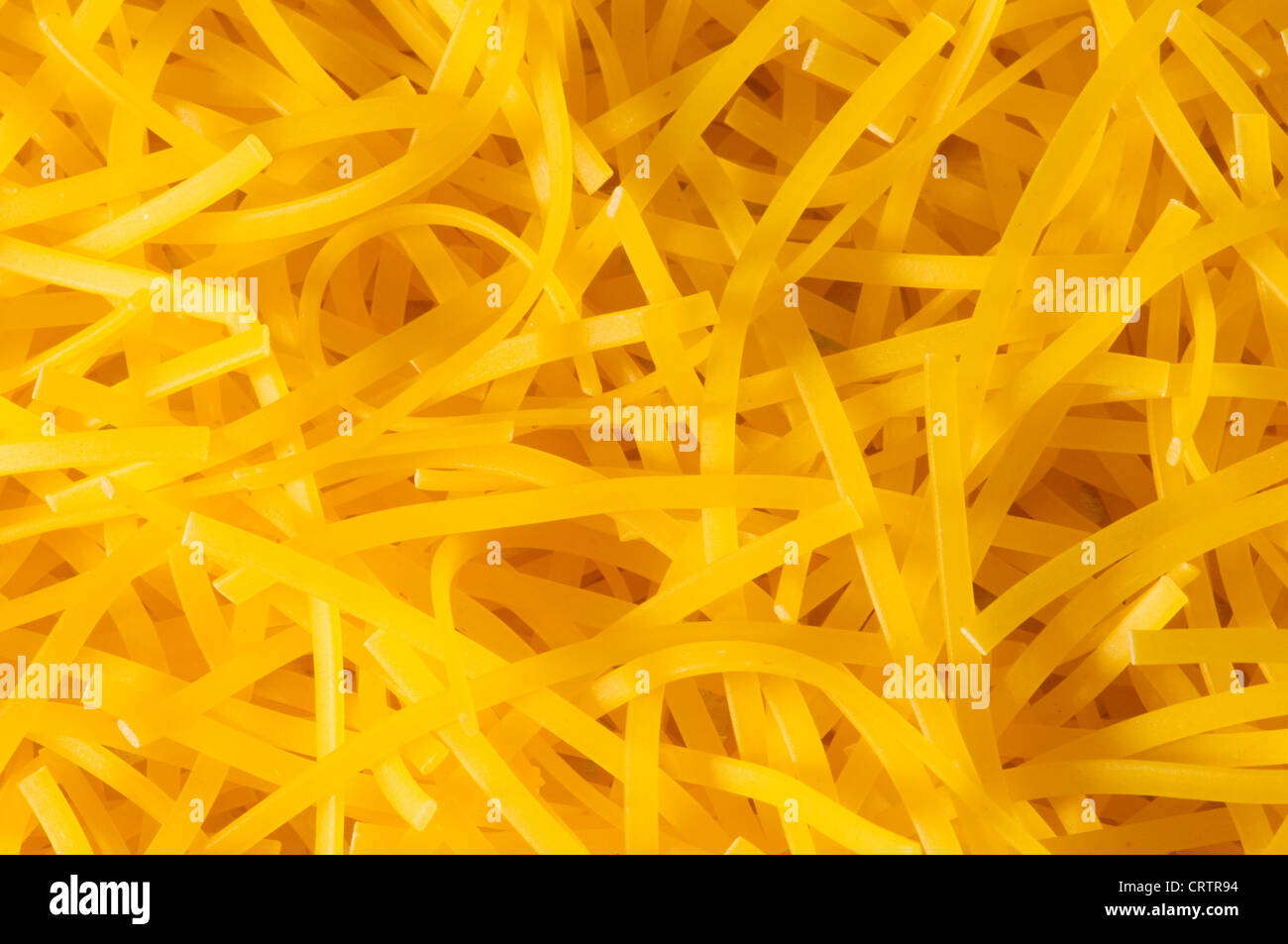 Extreme close up of yellow italian pasta Stock Photo - Alamy