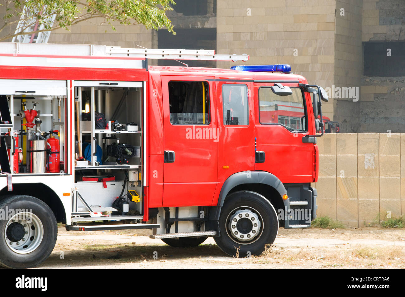 Fire engine at the scene of city fire Stock Photo - Alamy