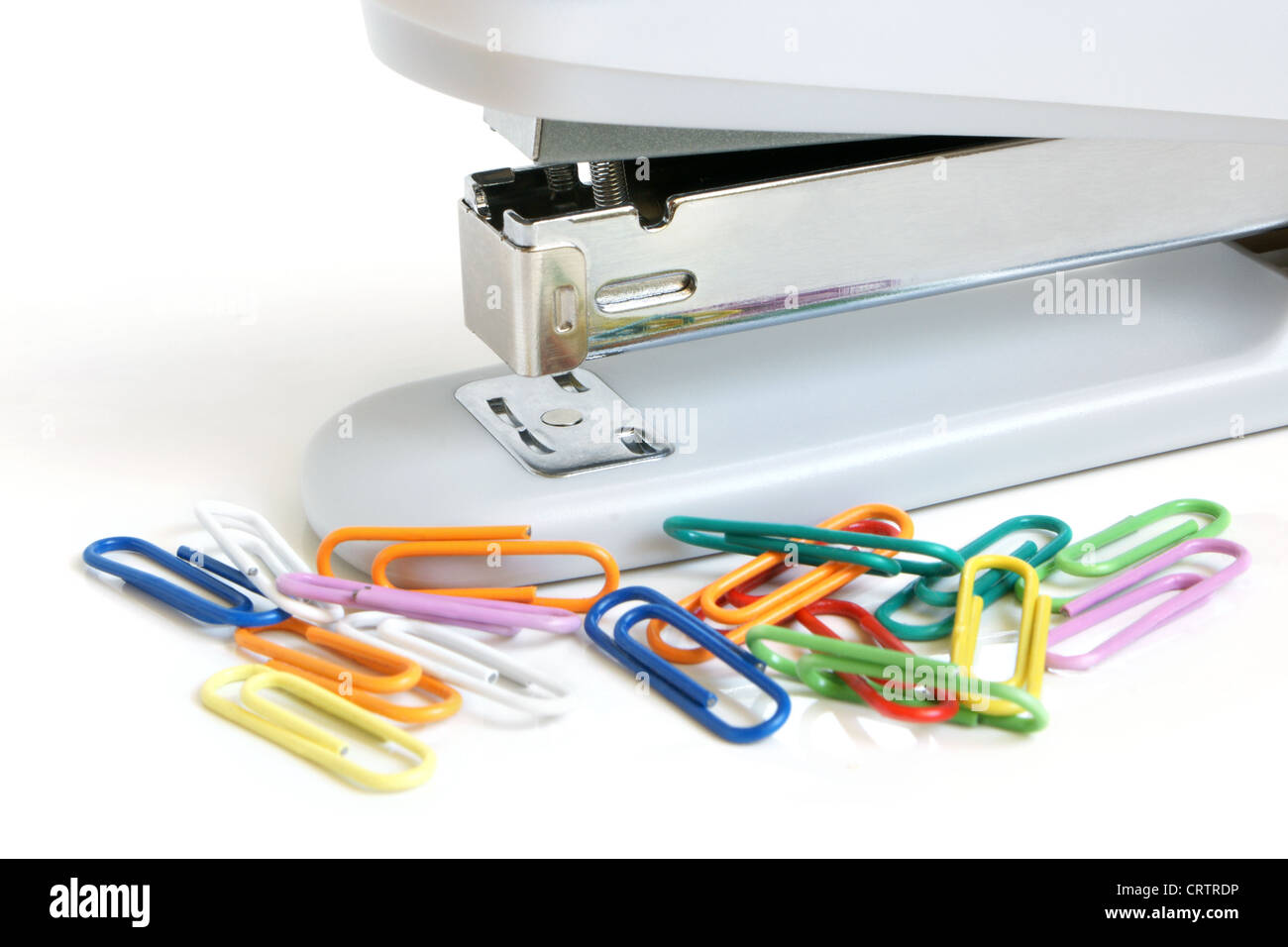 Stapler and multicolored paper clips Stock Photo - Alamy
