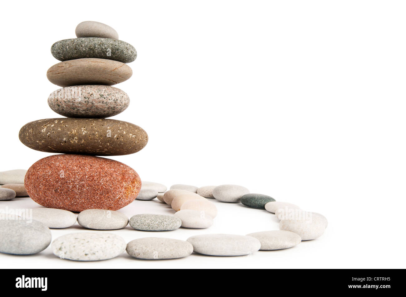 Stack of pebbles isolated on the white Stock Photo - Alamy