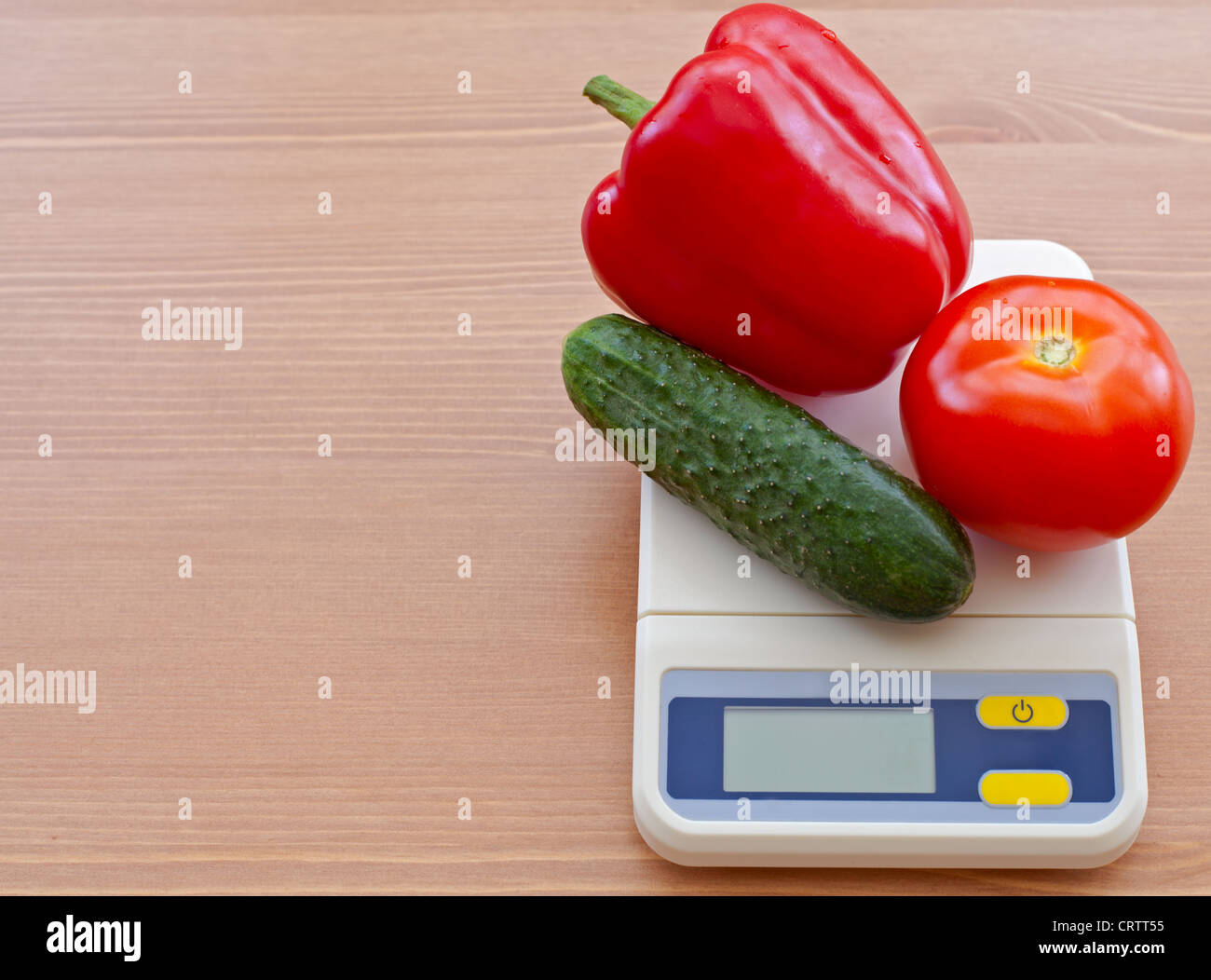 vegetables on electronic scale Stock Photo - Alamy