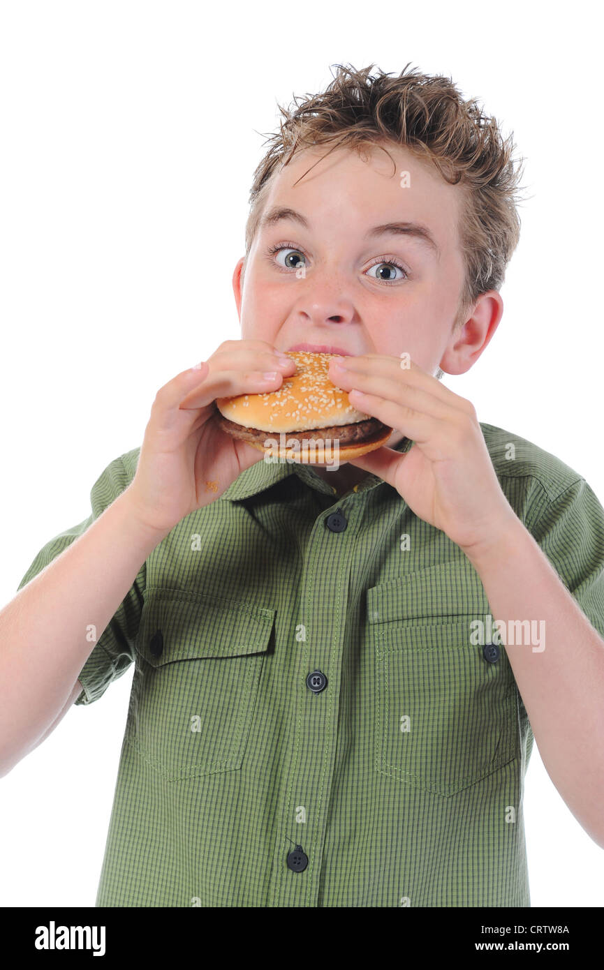 Little boy eating a hamburger Stock Photo - Alamy