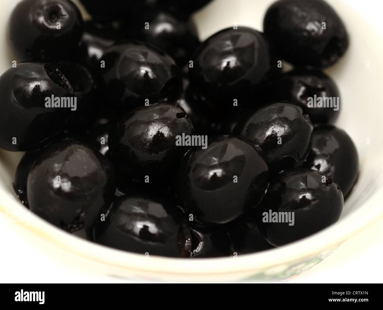 black olive in a bowl Stock Photo - Alamy