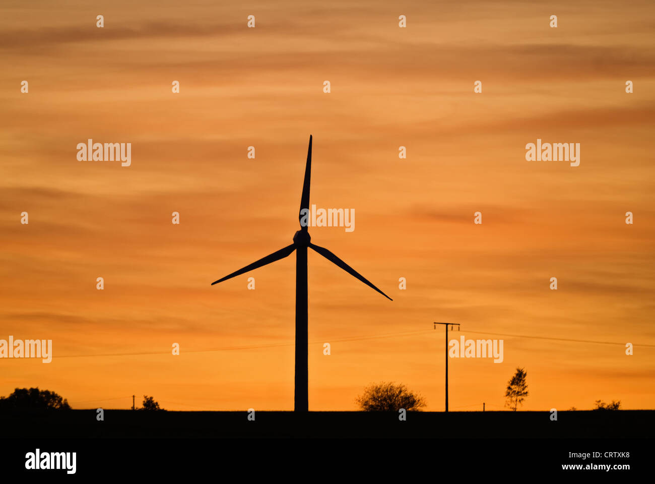 Wind turbine at sunset Stock Photo - Alamy