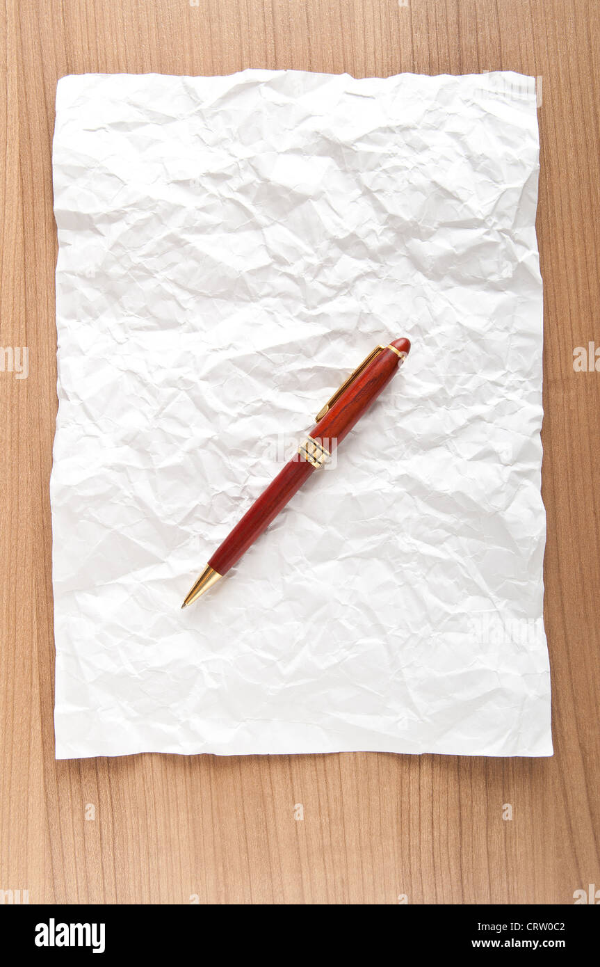 Paper background with pen Stock Photo - Alamy