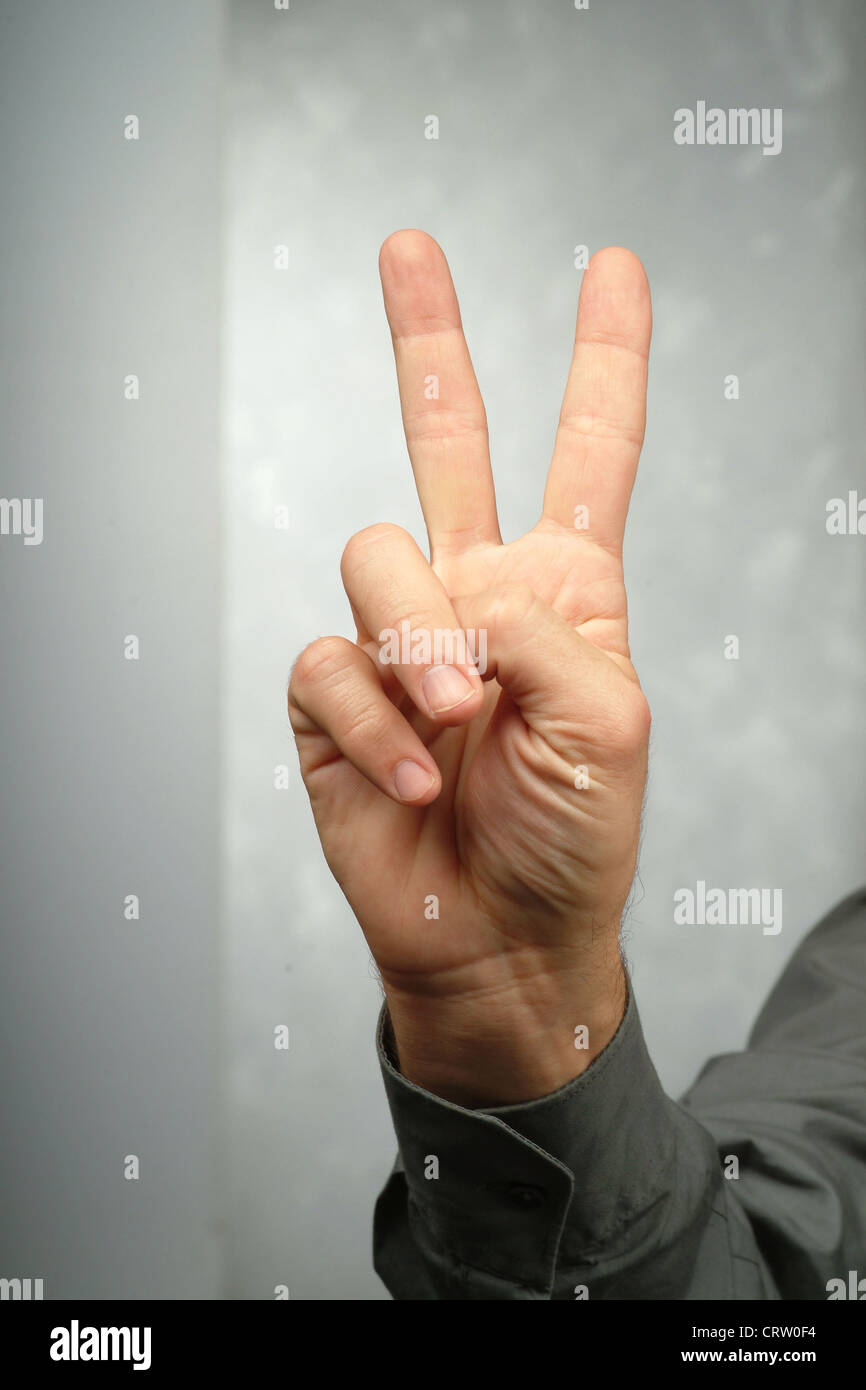 Hands - win or oath or number two Stock Photo - Alamy