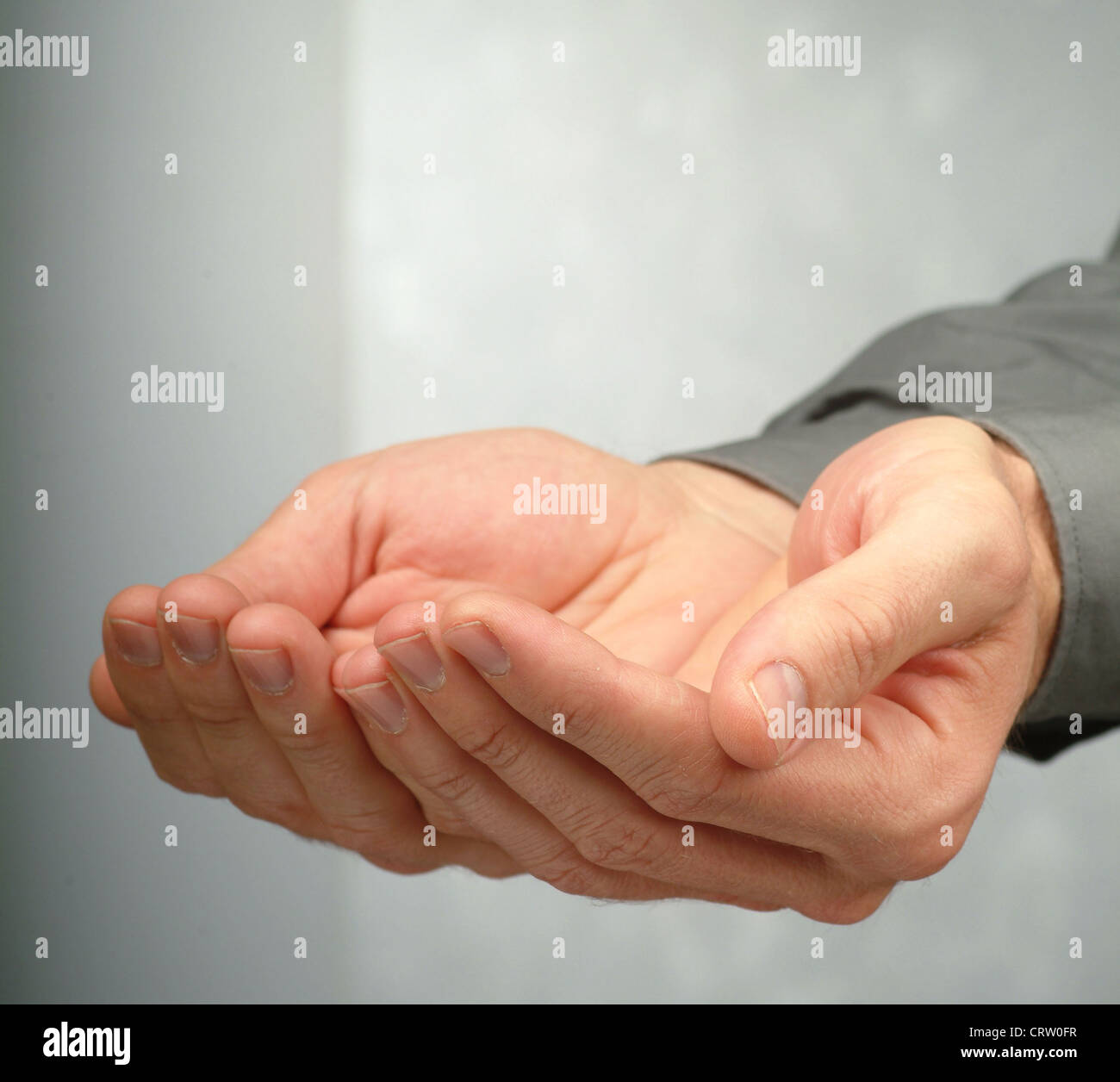 Hands - Bitten with both hands Stock Photo - Alamy