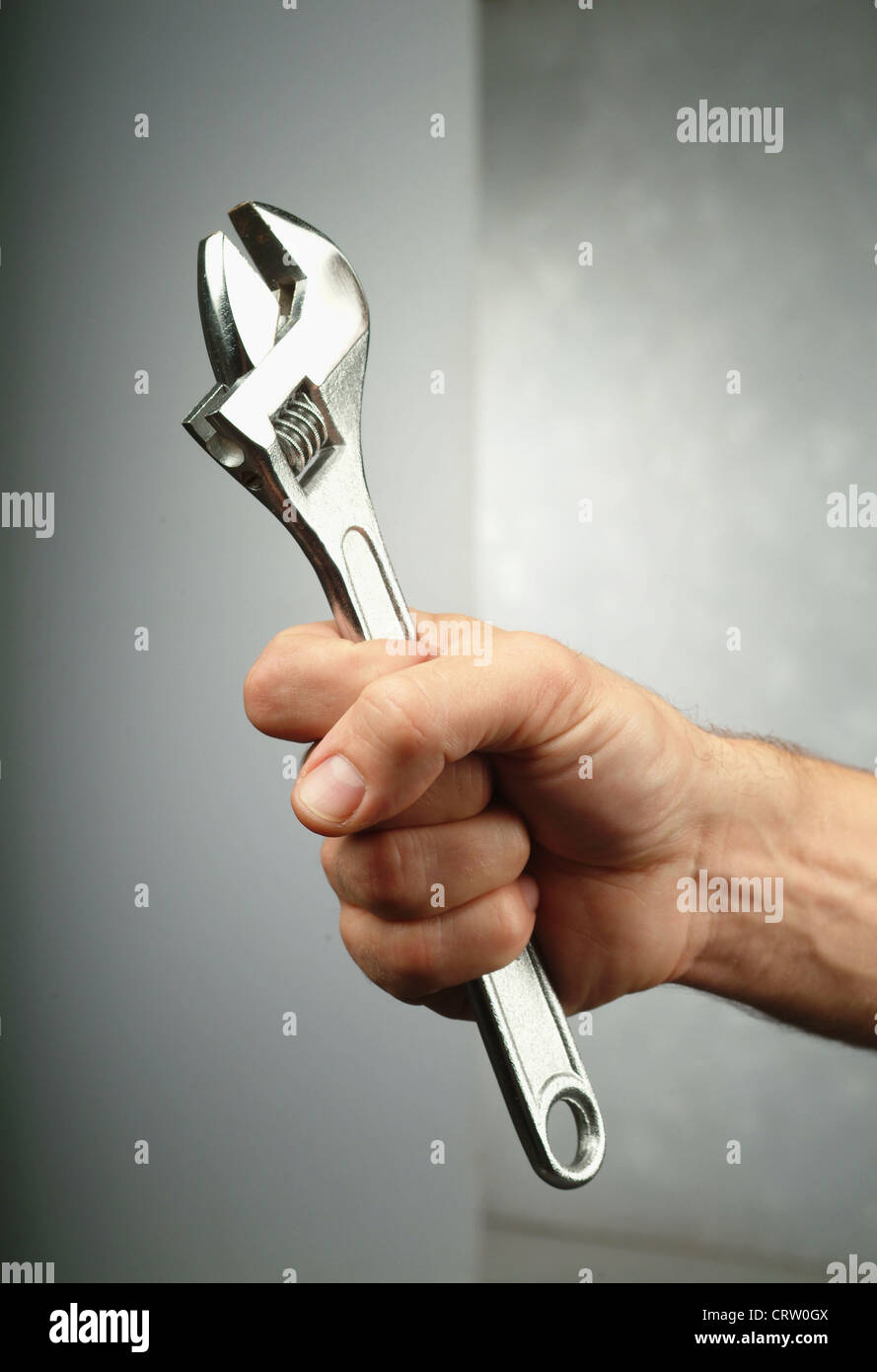 Hand with pliers Stock Photo - Alamy