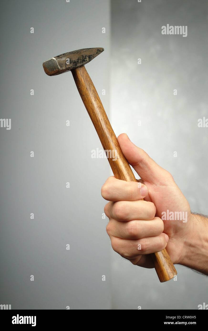 Hand with hammer Stock Photo - Alamy