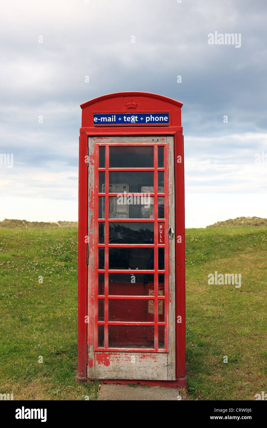 Red telephone box in rural surroundings Stock Photo - Alamy