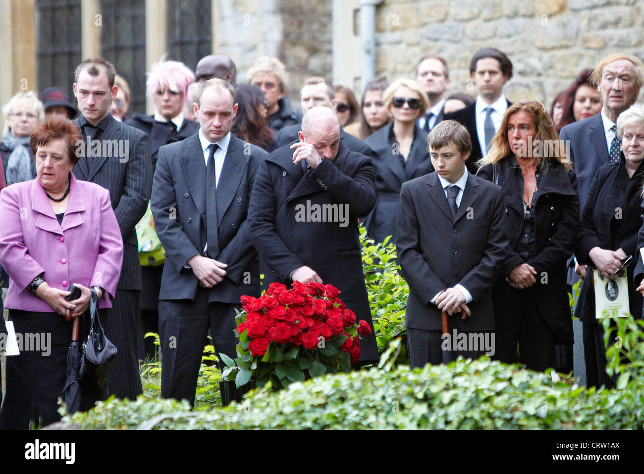 Mourners pay their respects at the funeral of Bee Gee singer Robin Gibb ...