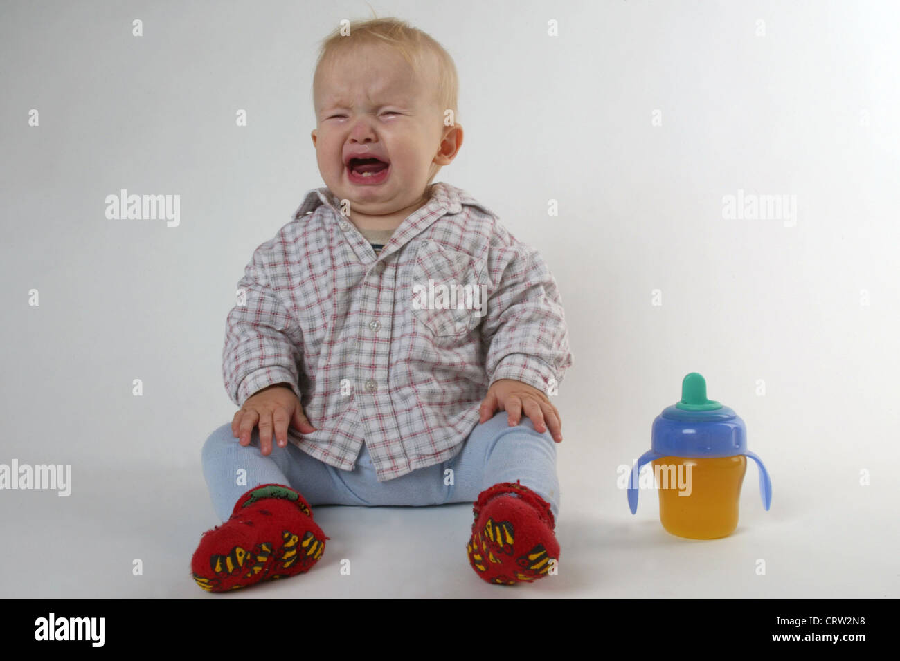 A small child cries bitterly Stock Photo - Alamy