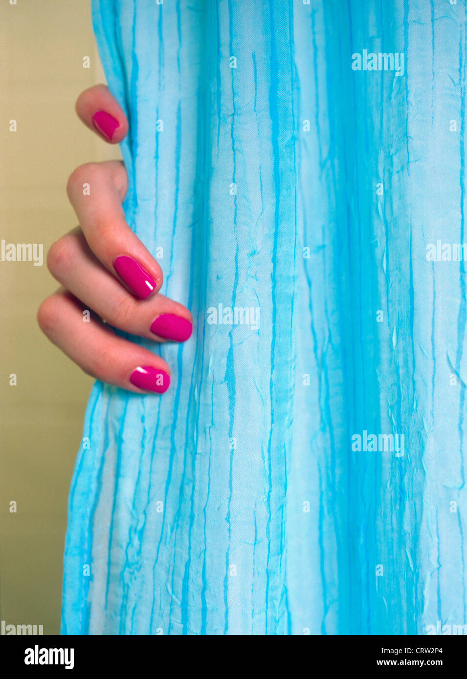 Woman pulling back a curtain hi-res stock photography and images - Alamy