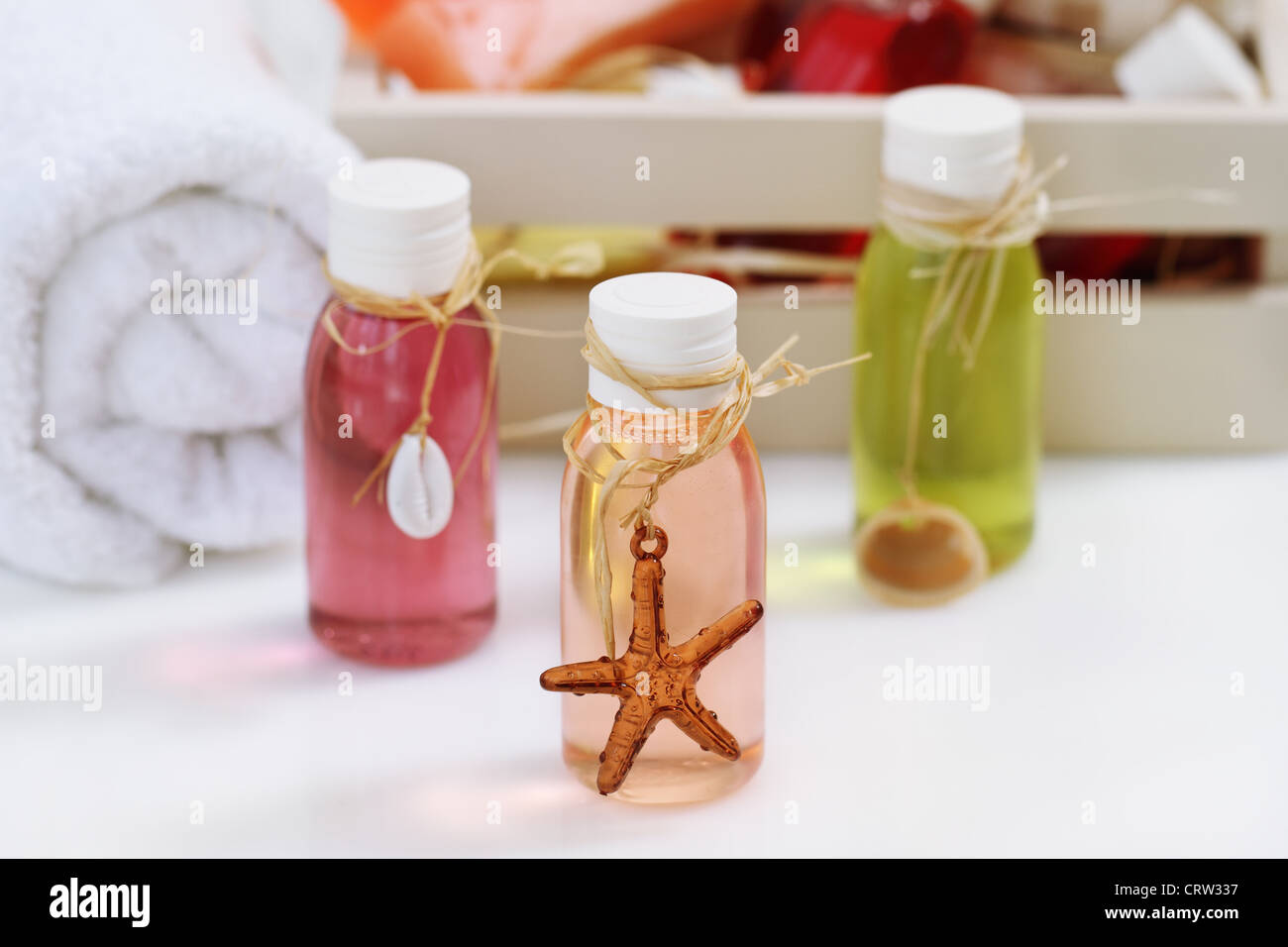 Spa setting with massage oil bottles Stock Photo - Alamy
