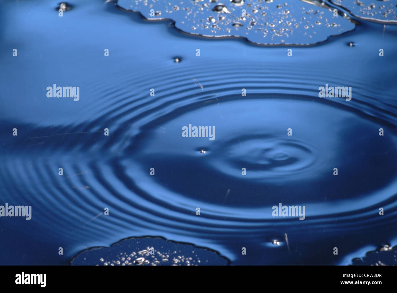 Water on a reflective surface Stock Photo - Alamy