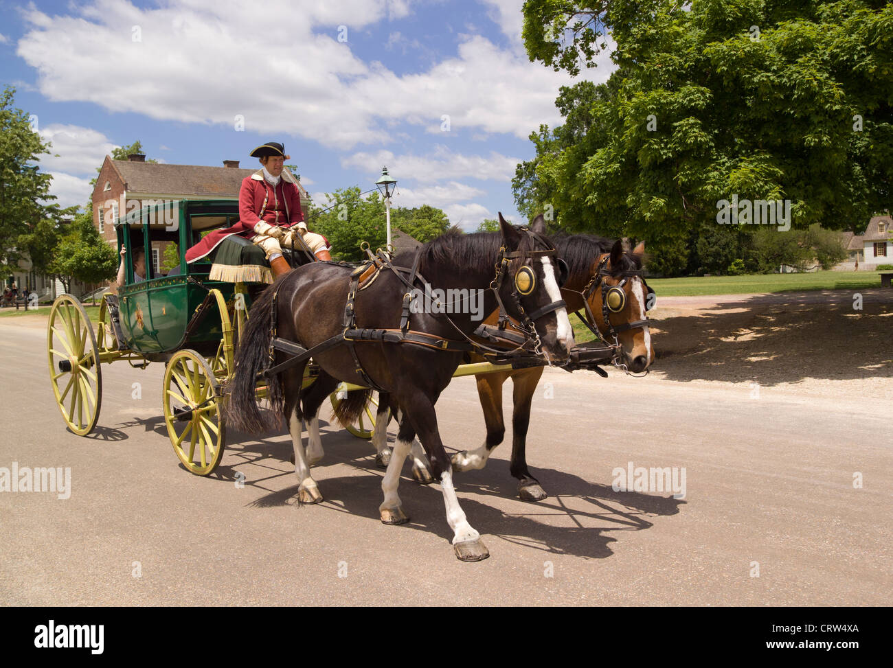 Tourists enjoy a leisurely horse-drawn carriage ride through the wide ...