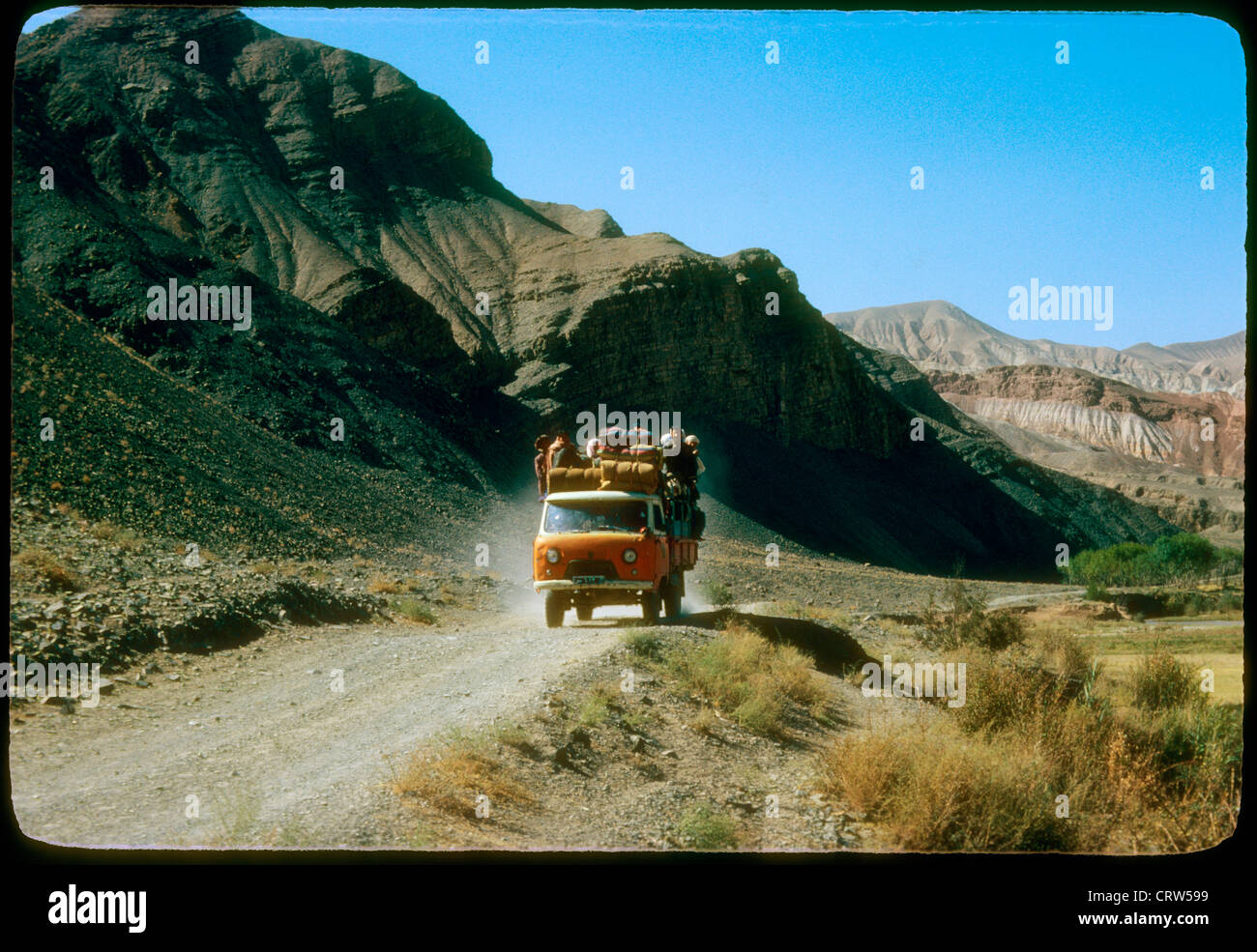 truck loaded down with travelers in rural area in afghanistan before ...