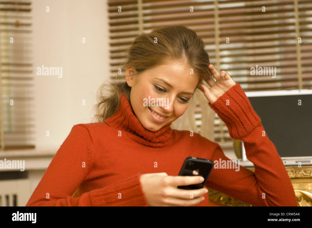 woman with cell smiles Stock Photo - Alamy