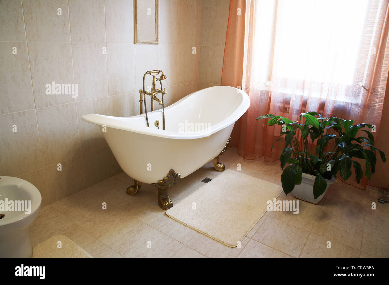 Bathroom with a beautiful bath Stock Photo - Alamy