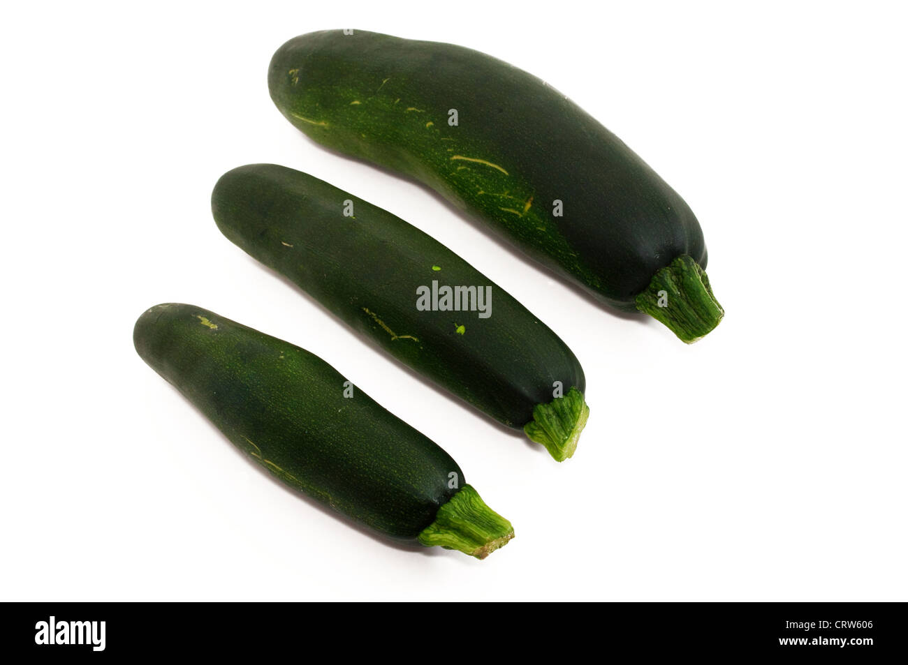 three green zucchini isolated on white background Stock Photo - Alamy