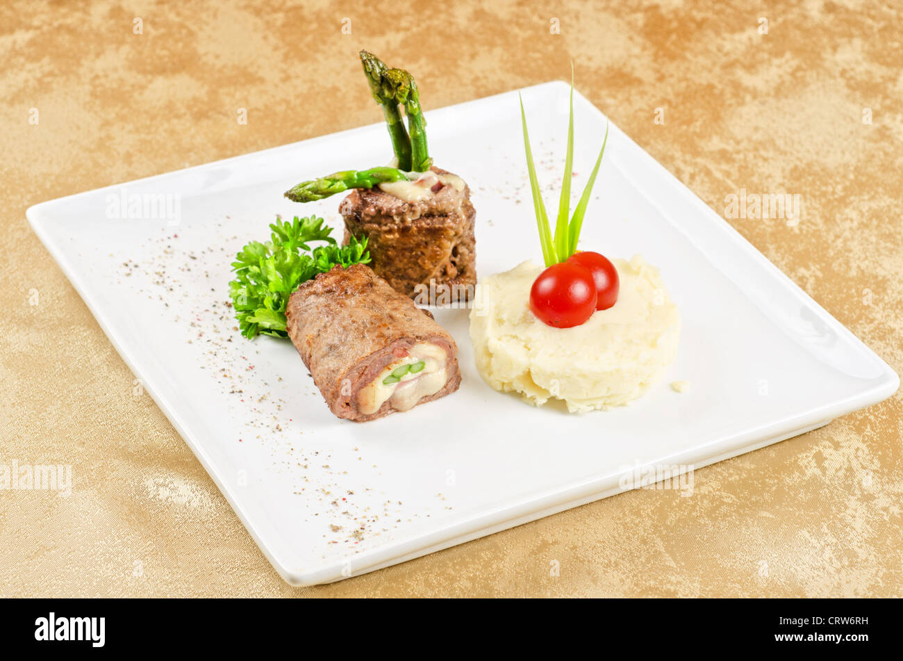 Grilled meat rolls from beef meat with mozzarella, ham, asparagus and ...