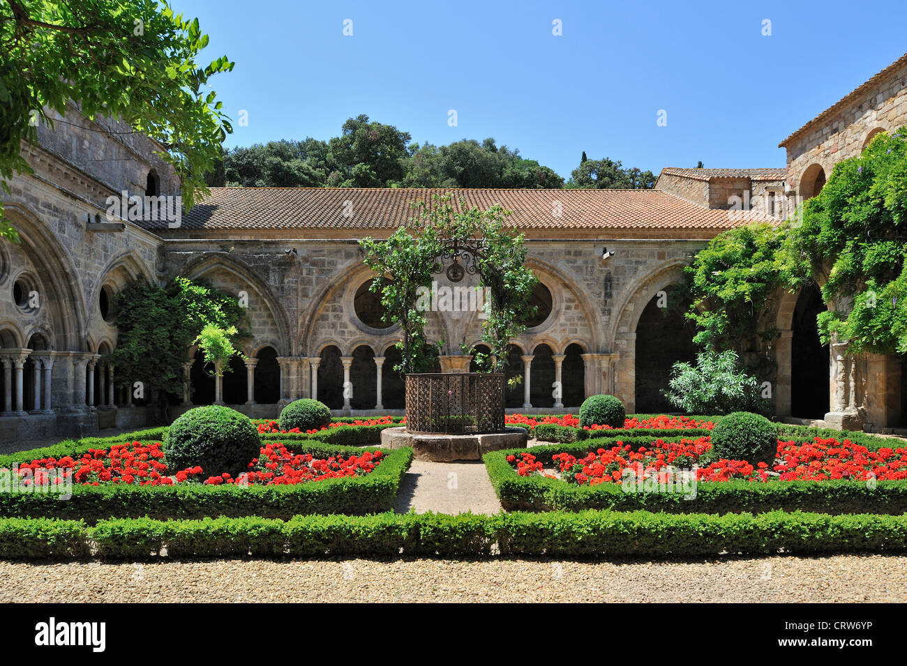 Cloister and well at the Abbaye Sainte-Marie de Fontfroide abbey ...