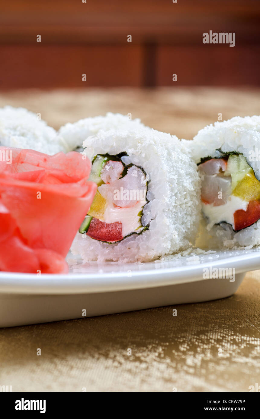 sushi roll of shrimp, cucumber, pepper and sauce, closeup Stock Photo ...