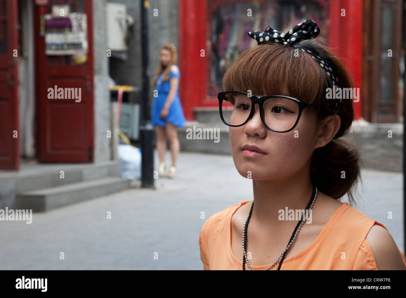 Model being photographed for a clothing website on Yandai Xiejie hutong ...