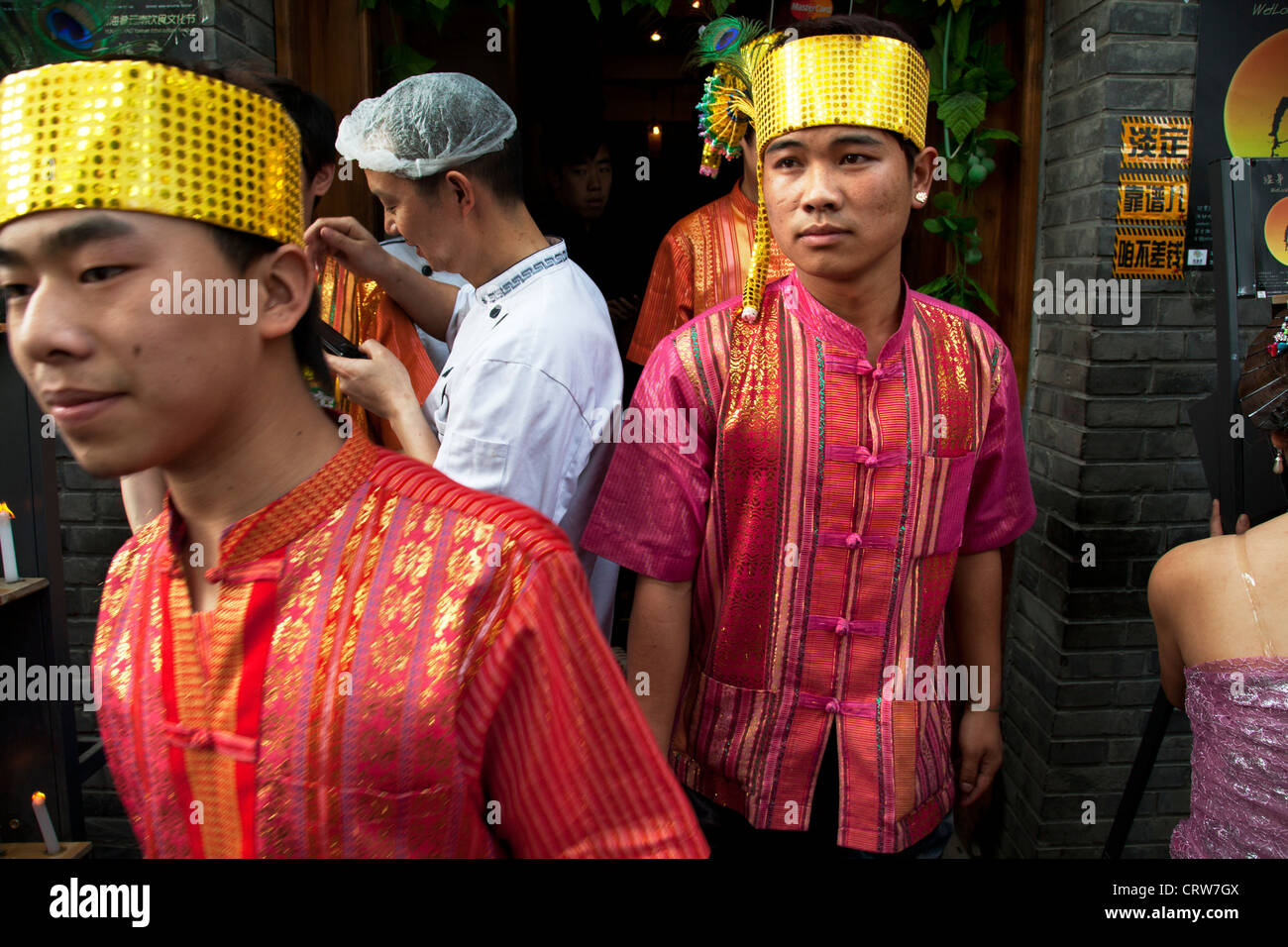 Traditional dancers dressed in beautiful costumes perform a dance on a ...