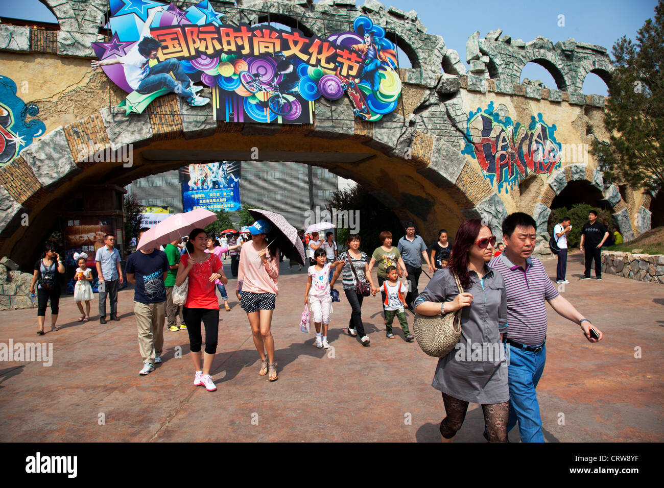 Visitors walking in Happy Valley Beijing, an amusement park in Beijing ...