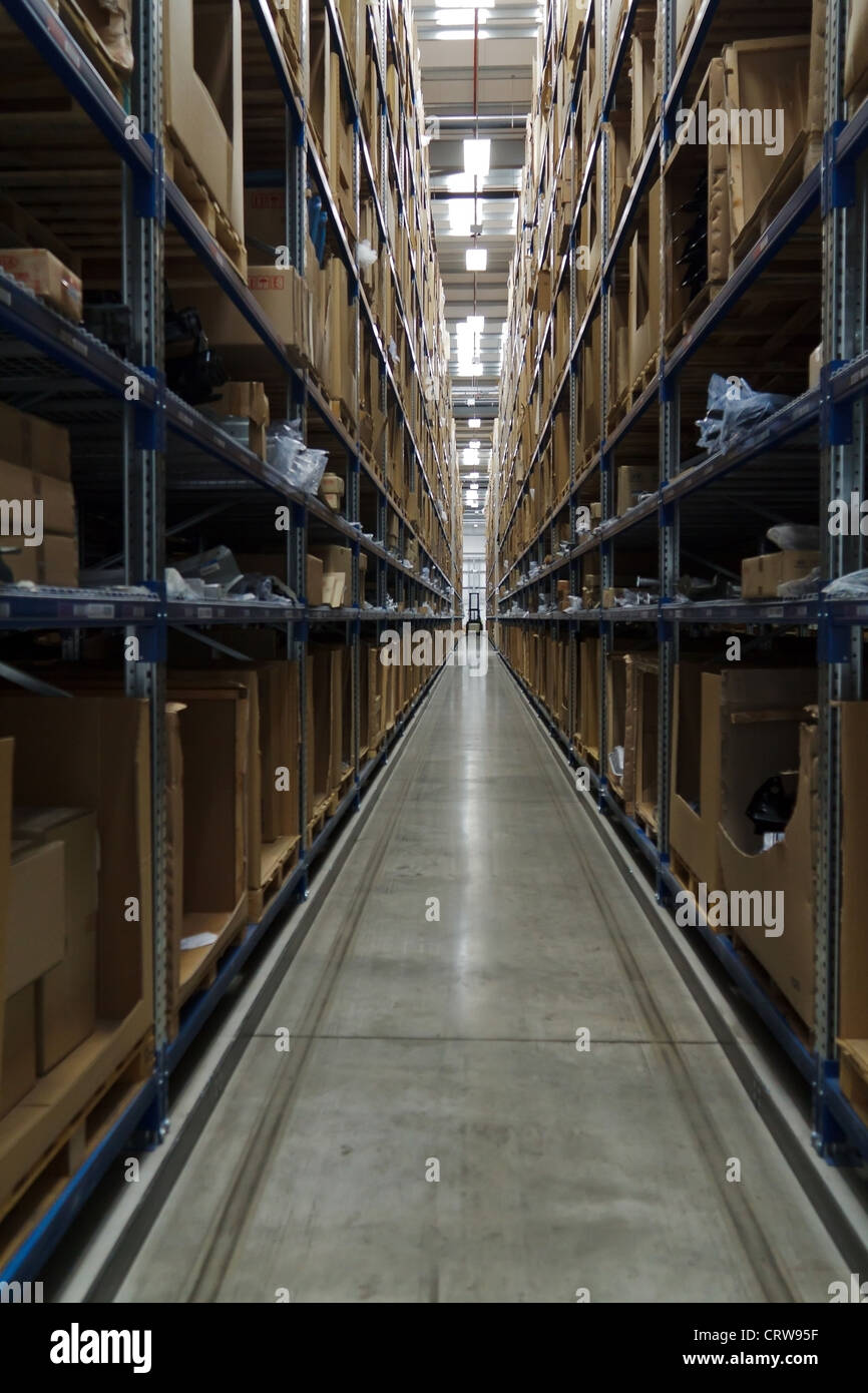 An aisle full of goods that are stored in a warehouse Stock Photo - Alamy