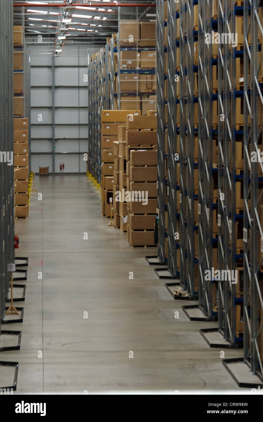An aisle showing a part of a warehouse Stock Photo - Alamy