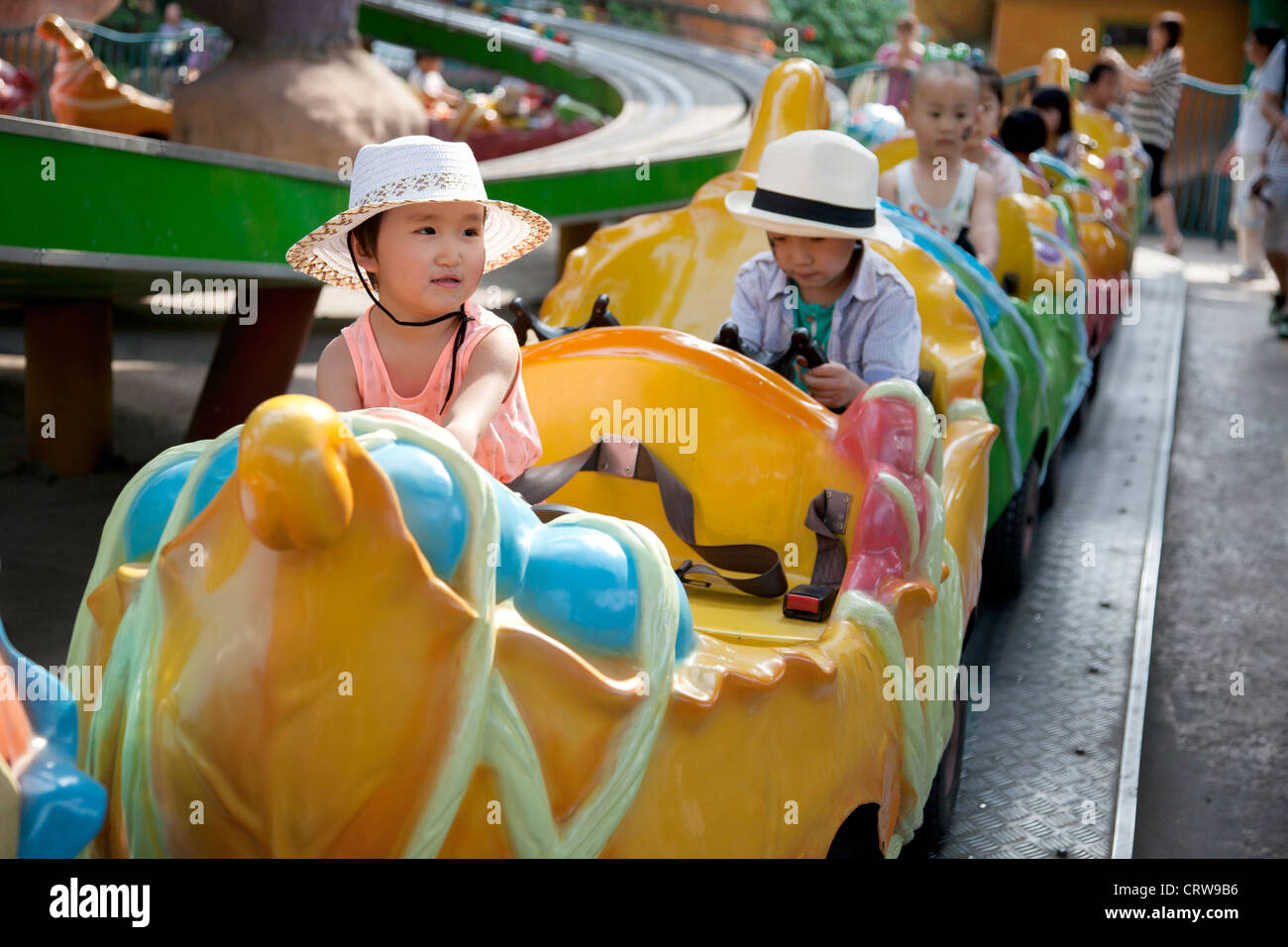 Young children enjoying a gentle ride. Happy Valley Beijing is an ...