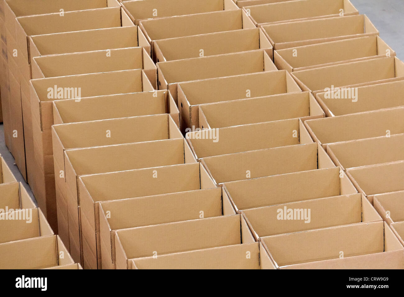 A stack of boxes in a warehouse Stock Photo - Alamy