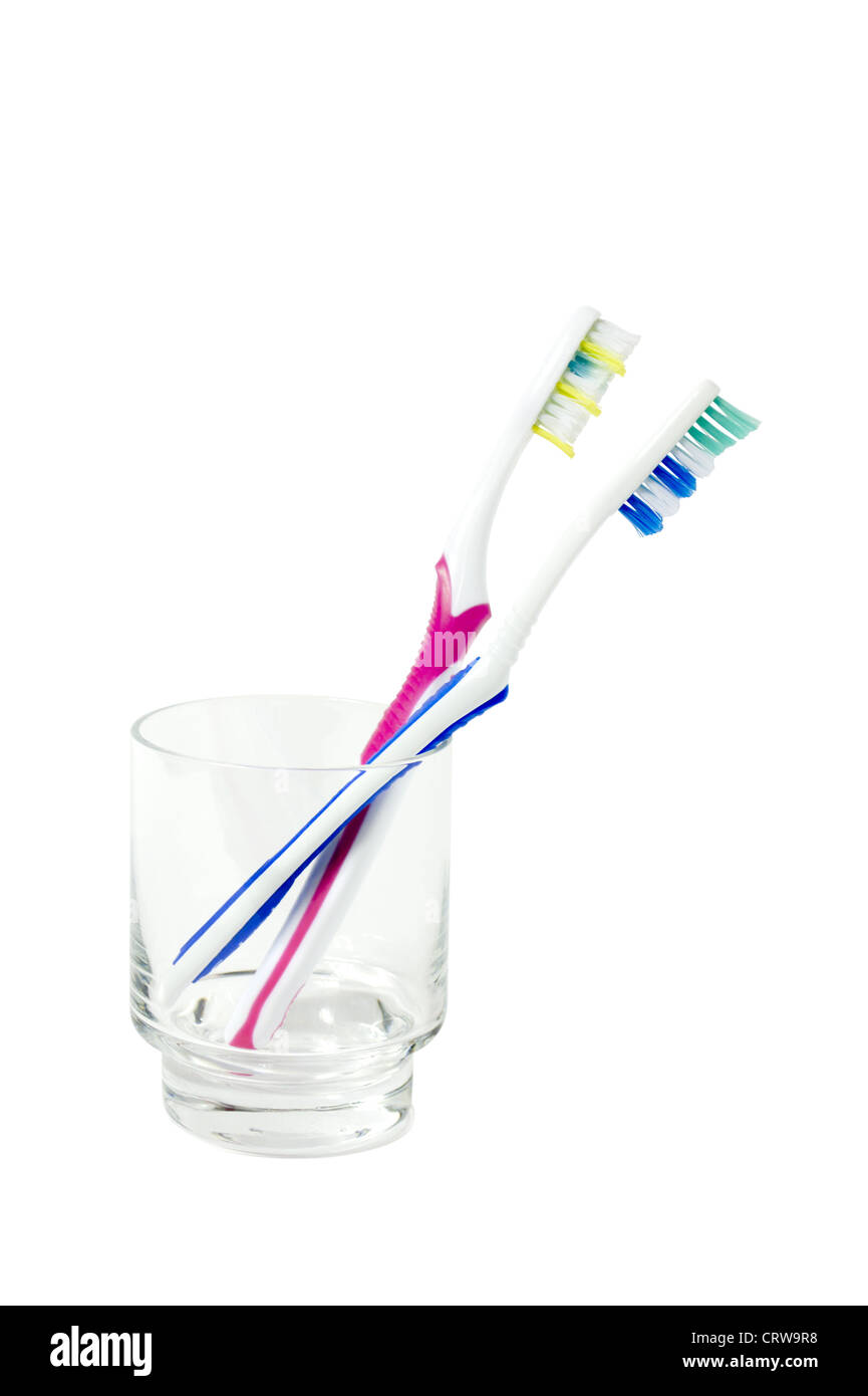 two toothbrushes in a glass isolated Stock Photo - Alamy two toothbrushes in a glass isolated Stock Photo - Alamy